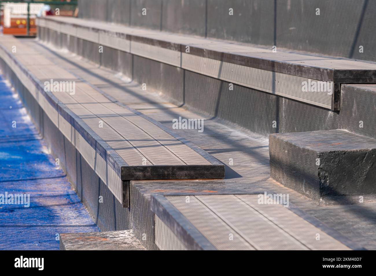 Seating area for spectators made with composite deck next to the tennis ...