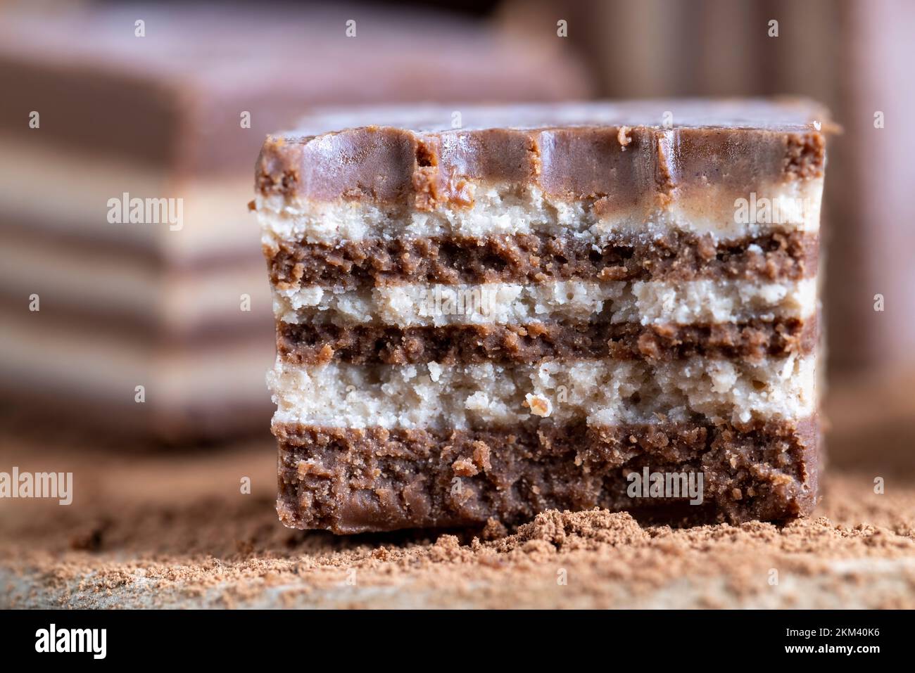 multi layered sweets made of cream and chocolate layers with different ...