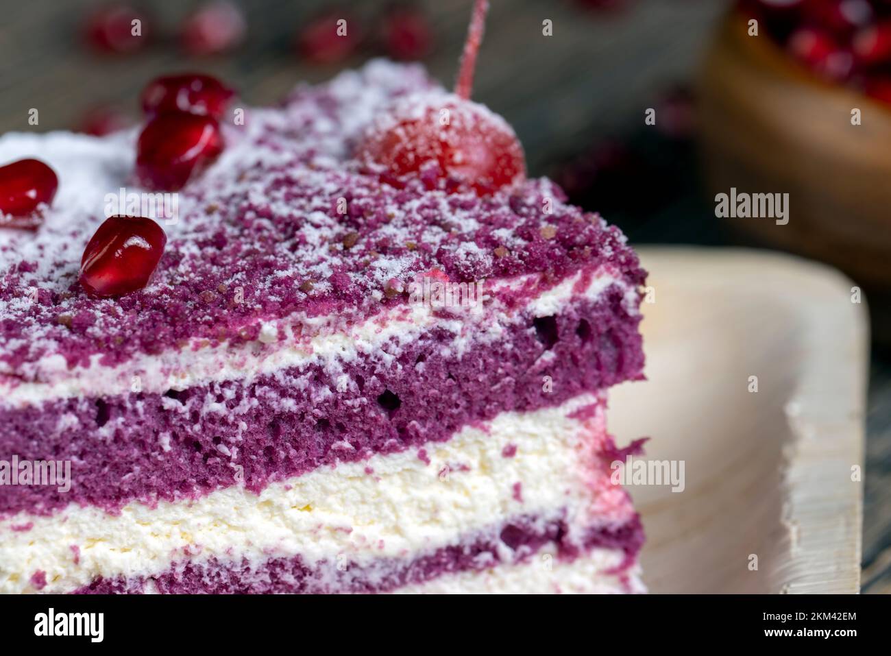 a maroon colored cake with the taste of different berries and a creamy ...