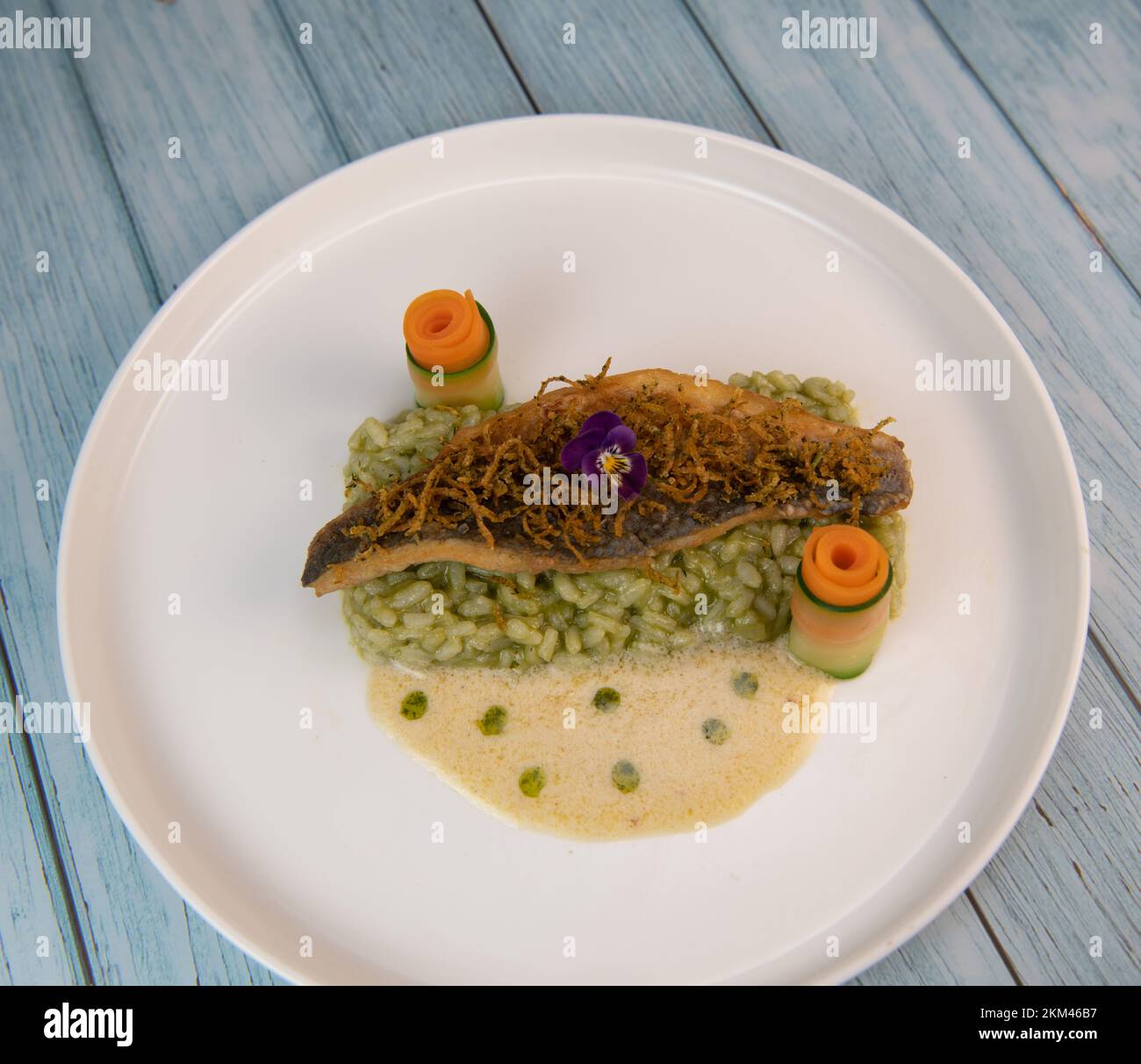 Recipe for fried fillet of sea bass with herb risotto, white wine sauce ...