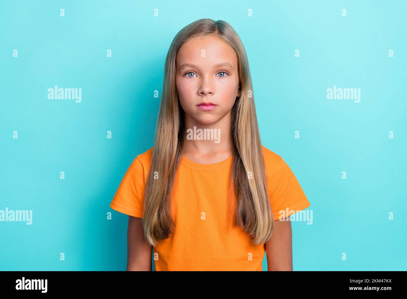Photo portrait of adorable nice little girl calm face look camera wear ...