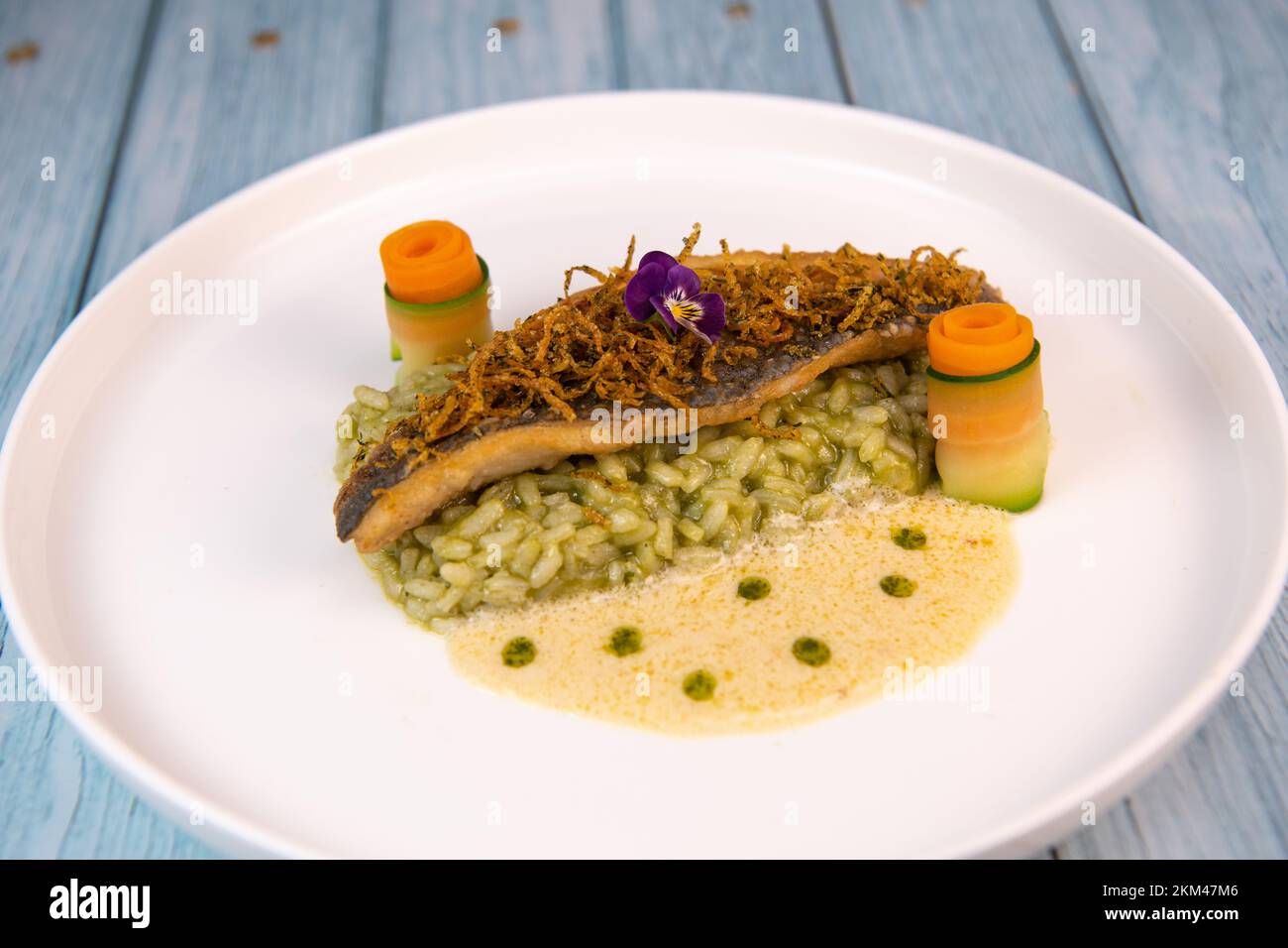Recipe for fried fillet of sea bass with herb risotto, white wine sauce ...