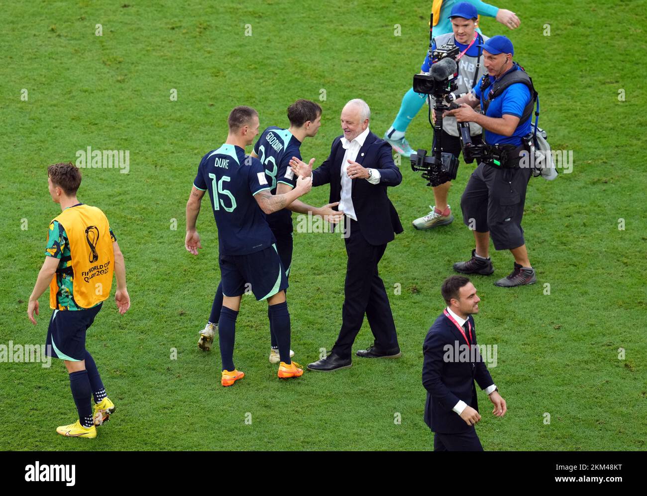 Australia manager Graham Arnold celebrates goal scorer Mitchell Duke ...