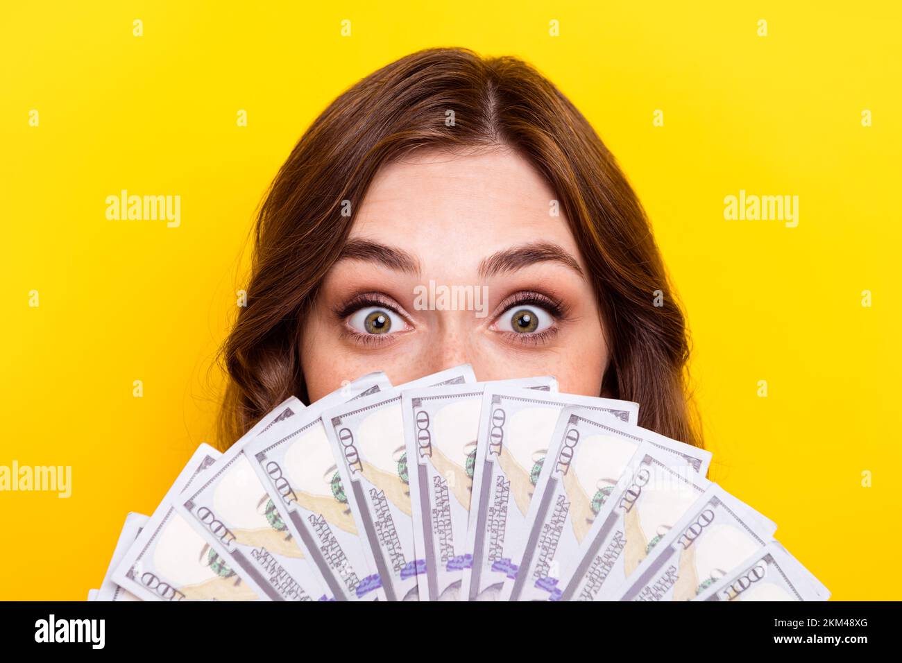 Photo of impressed funky funny girl money fan cover half face isolated ...