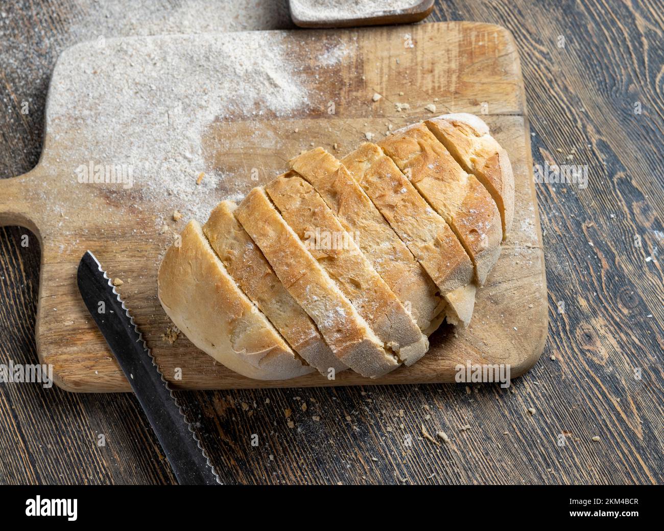 cut fresh bread into pieces while cooking with bread, the bread is cut ...