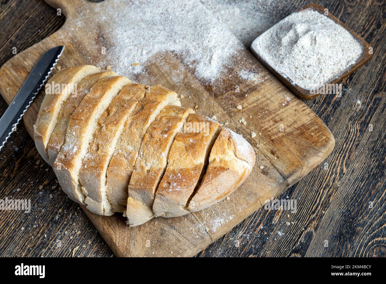 cut fresh bread into pieces while cooking with bread, the bread is cut ...