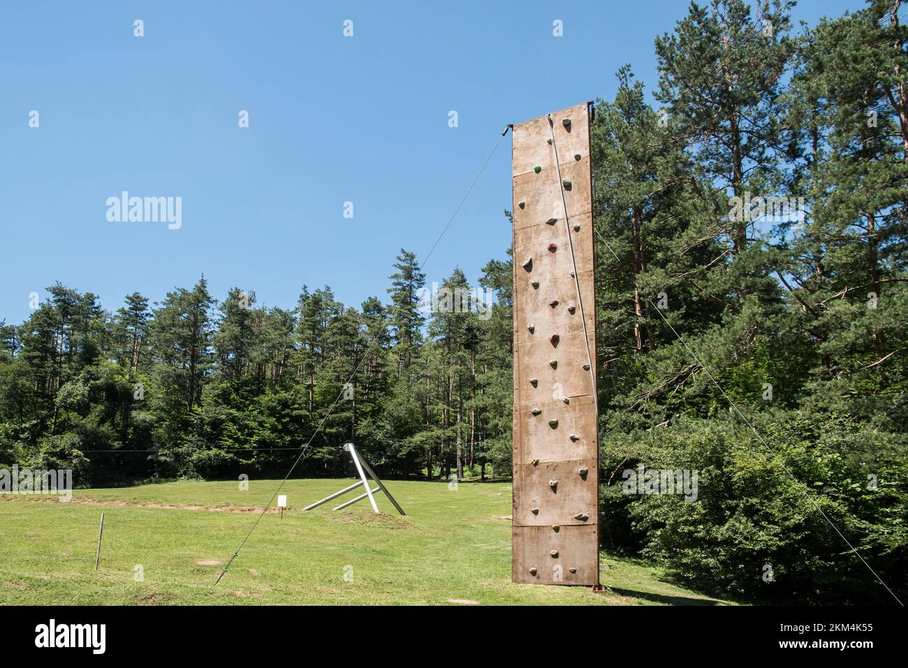 Artificial rock climbing wall outdoor on mountain meadow Stock Photo ...