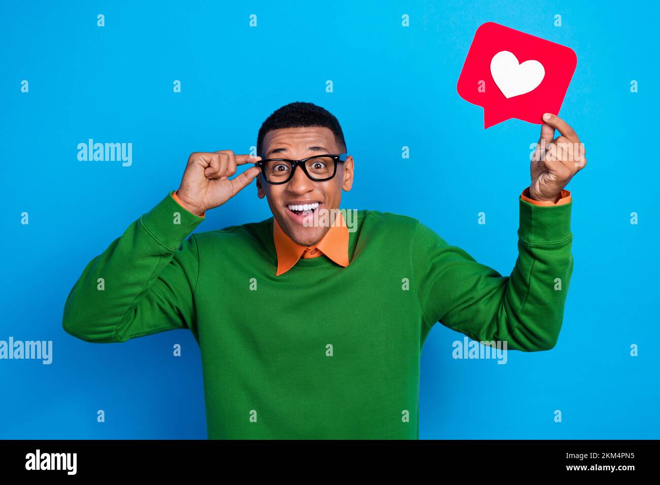 Photo of young excited guy student wear formal clothes hold red paper ...