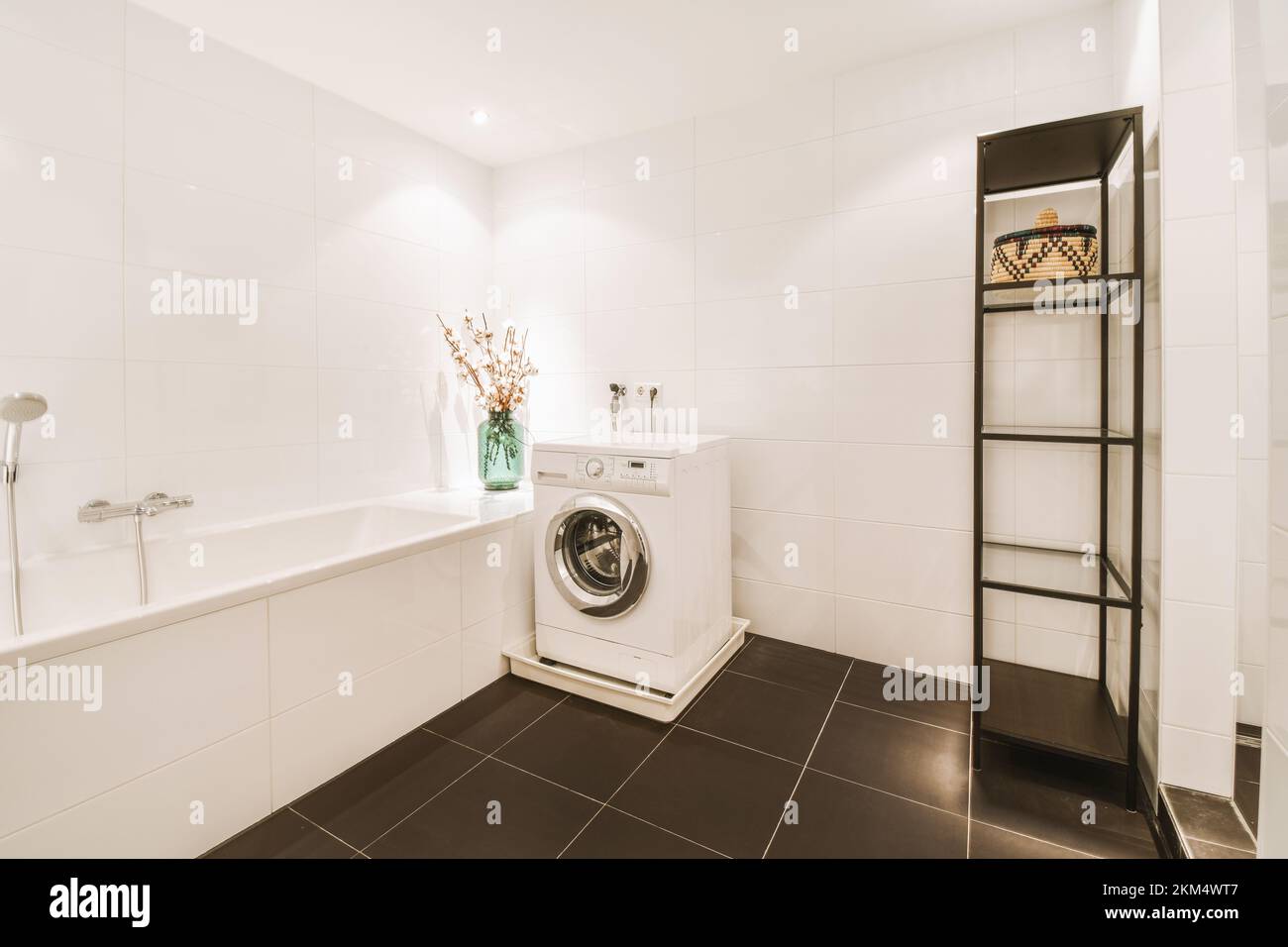 White ceramic sink and mirror with illumination in bathroom designed in ...