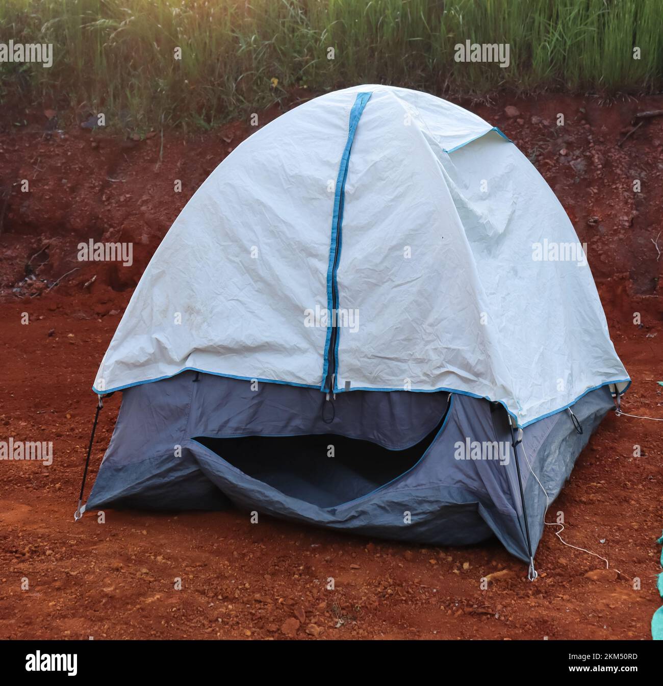 camping tent in full assembled condition at camp side outdoor location ...
