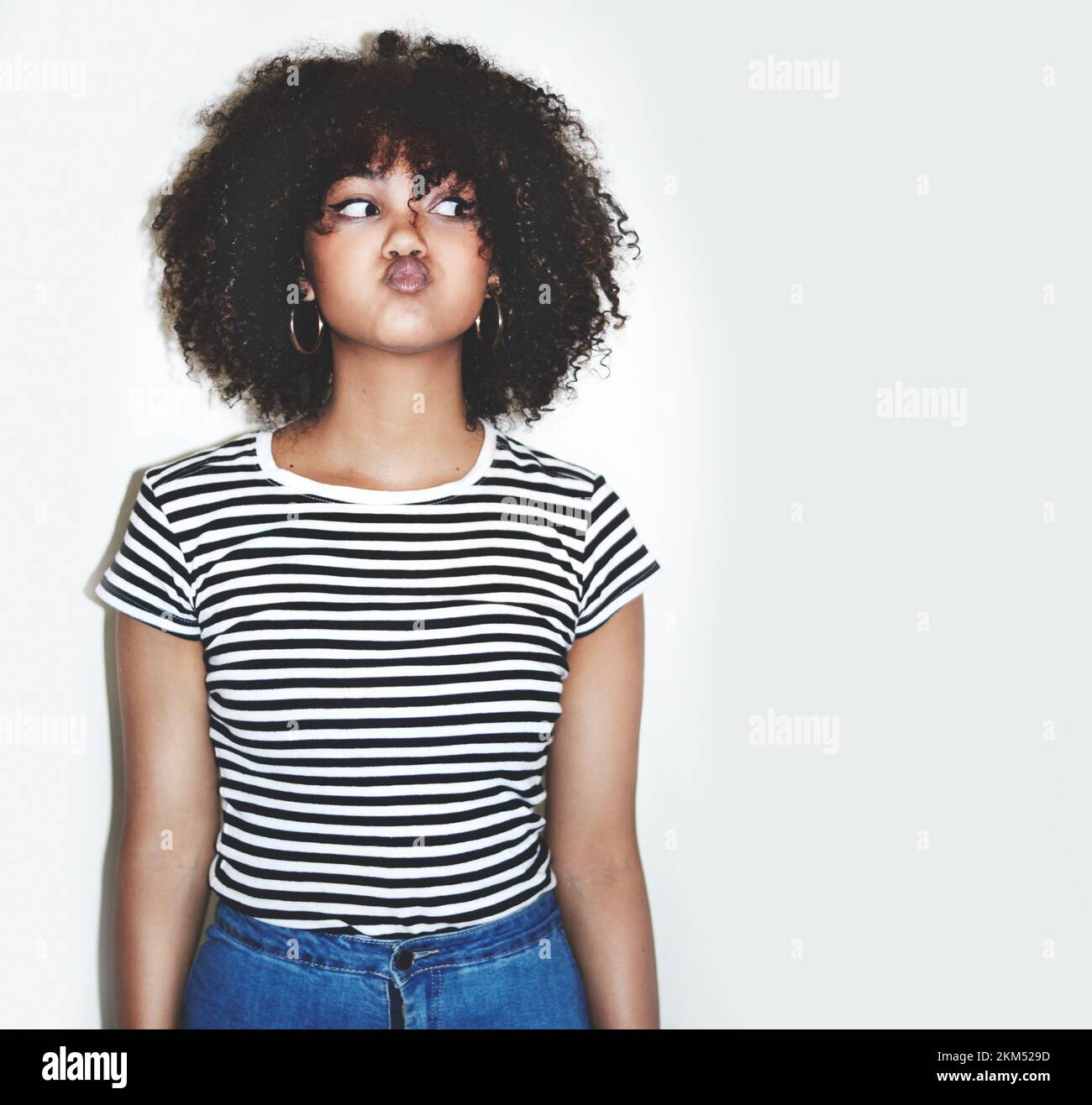 Young black woman, funny face and playful with lips pout, comic, crazy ...