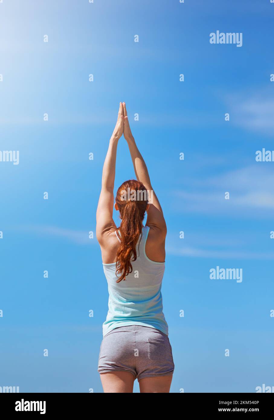 Woman, exercise and yoga for meditation with hands in air against blue ...