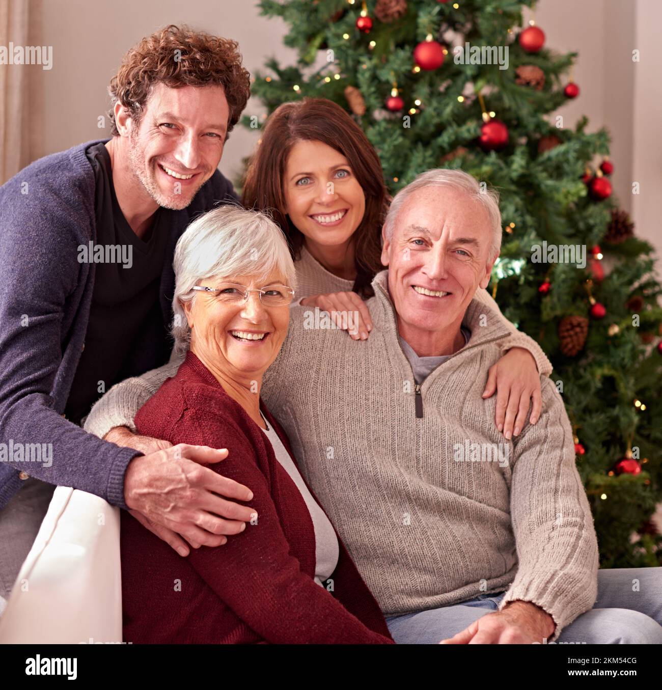 Happy family, portrait and grandparents home for Christmas to celebrate ...