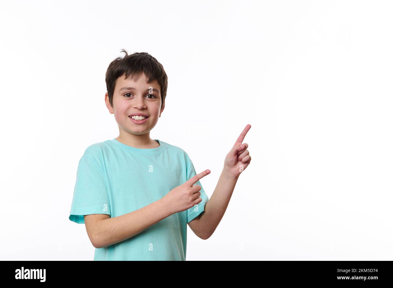 Adorable smiling preteen child, school age boy looking at you and ...