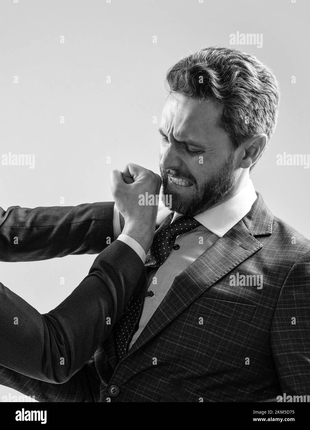 Professional man employee got punch in face with fist grey background ...