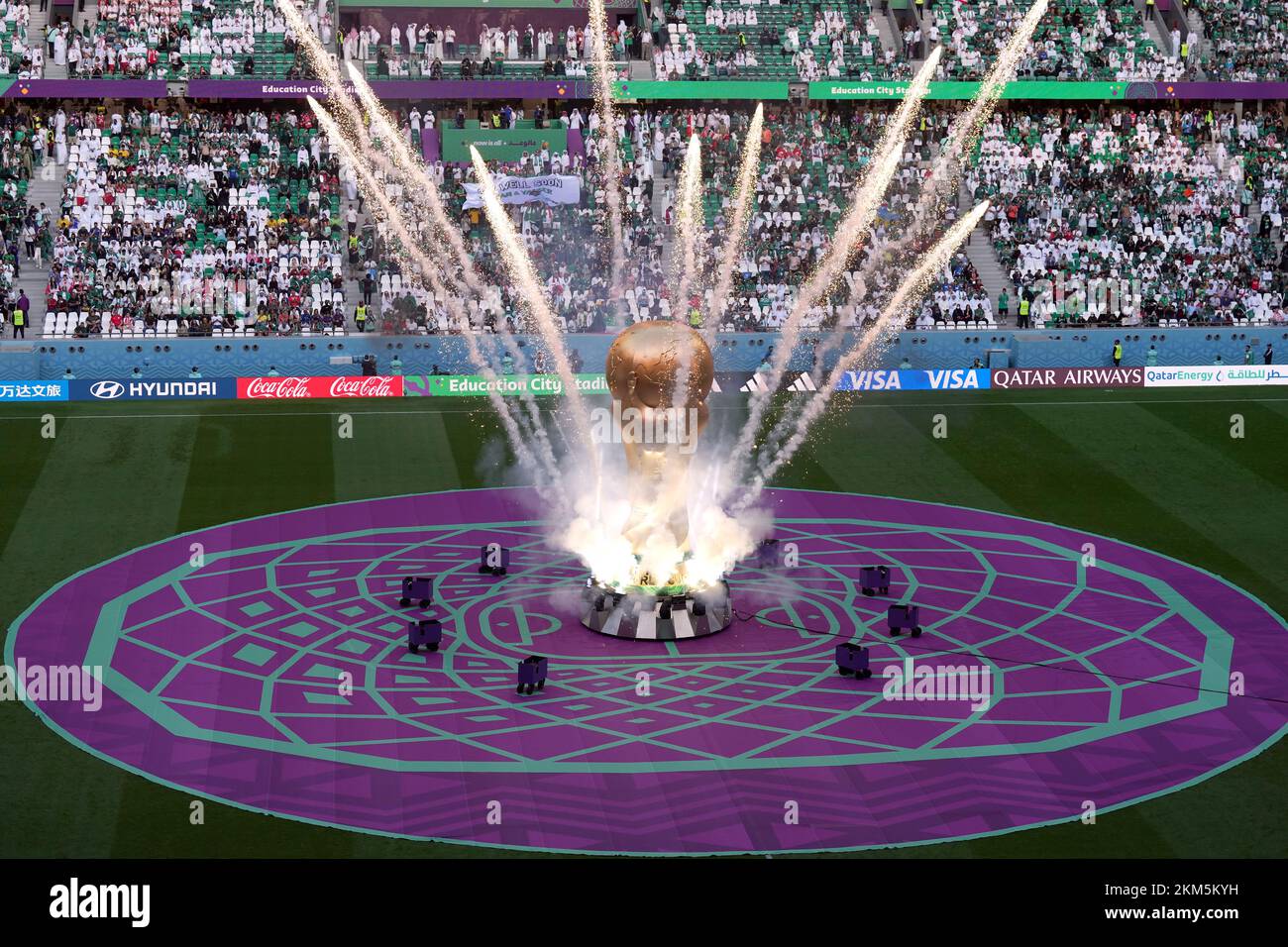 Pre match pyrotechnics around a giant replica trophy during the FIFA ...