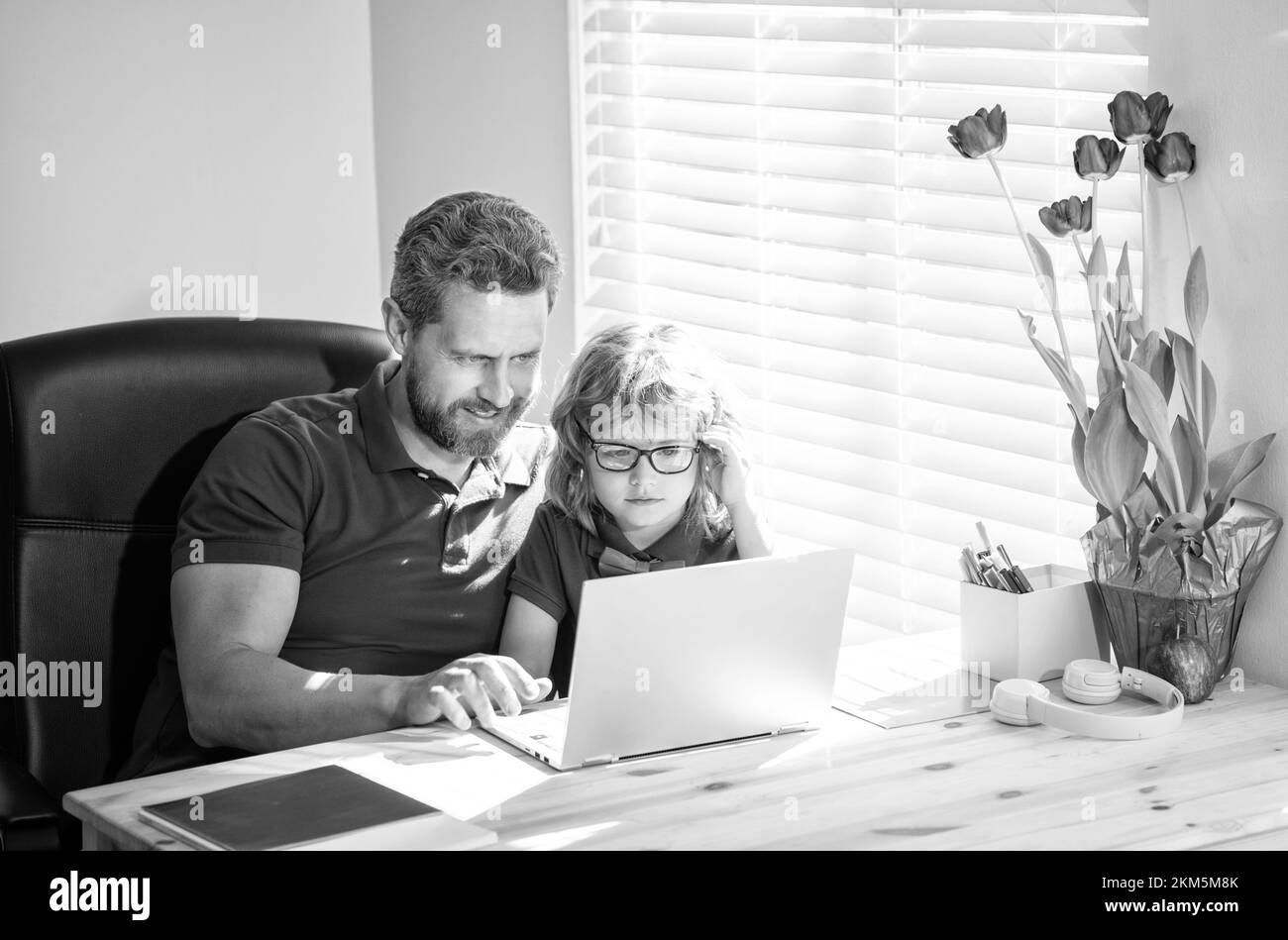 homeschooling and elearning. back to school. father and son in ...