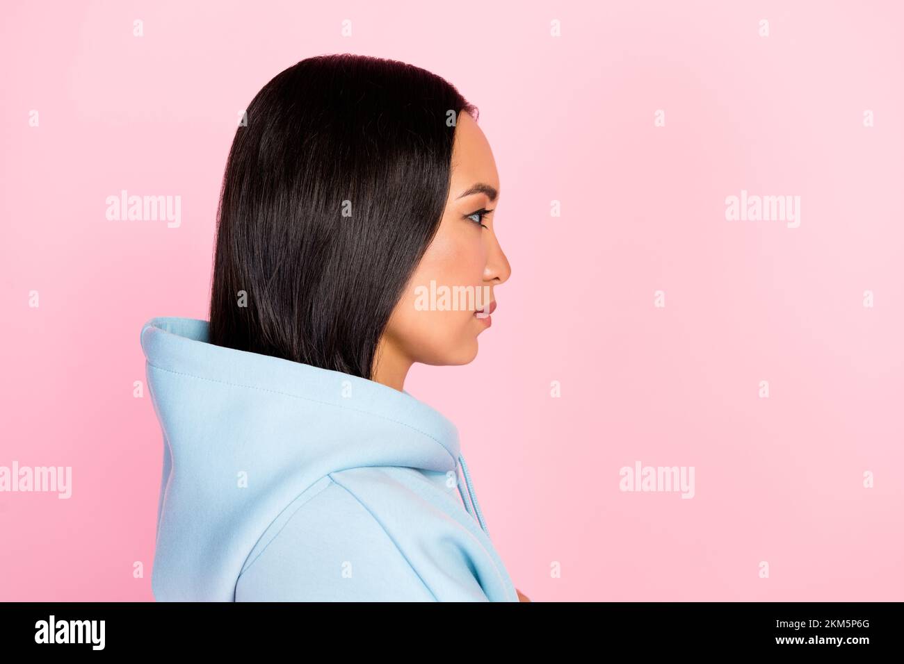 Photo of adorable shiny girl dressed blue sweatshirt looking empty ...