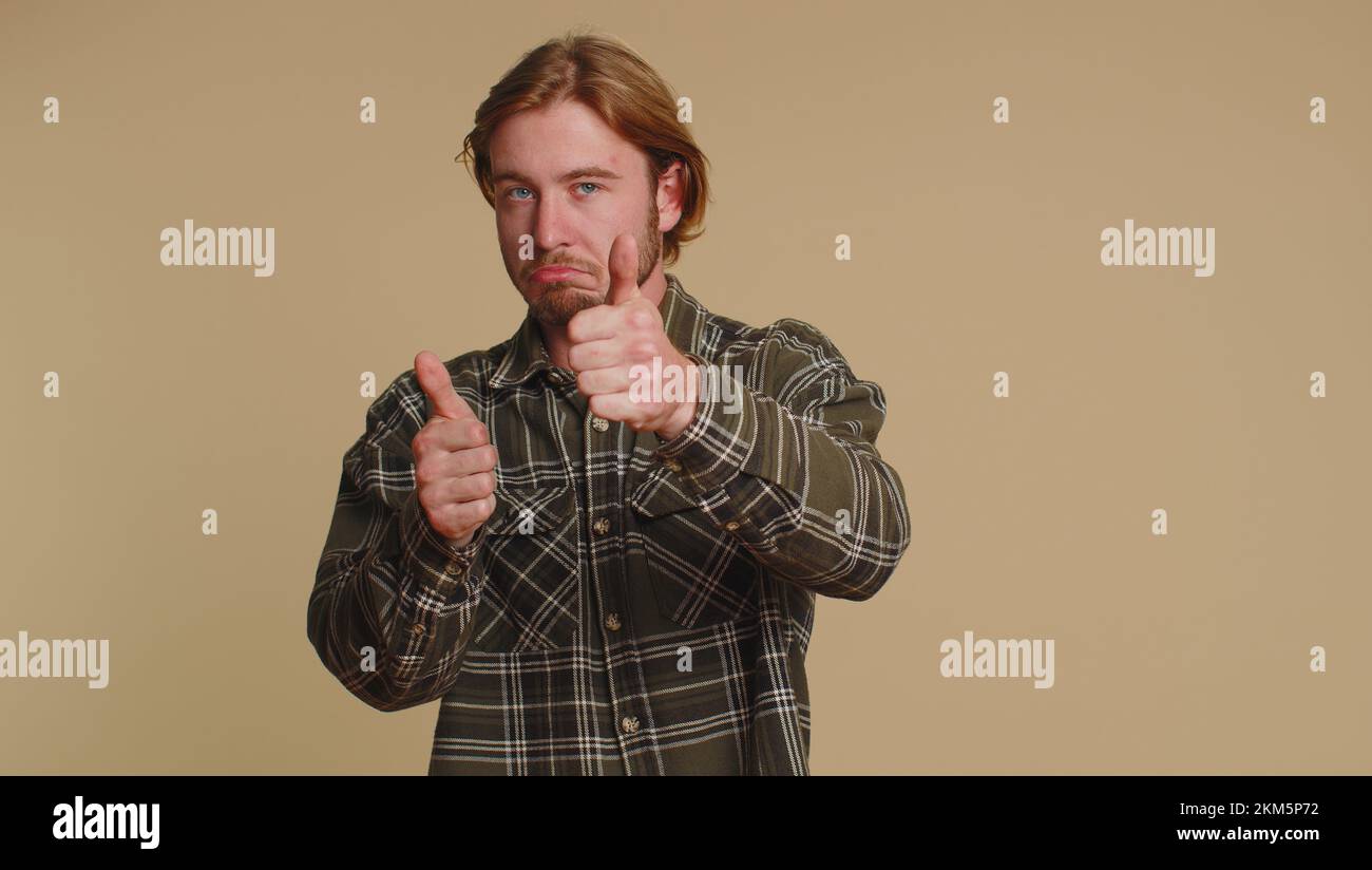 Great job, nice. Cheerful positive happy bearded man in shirt showing ...