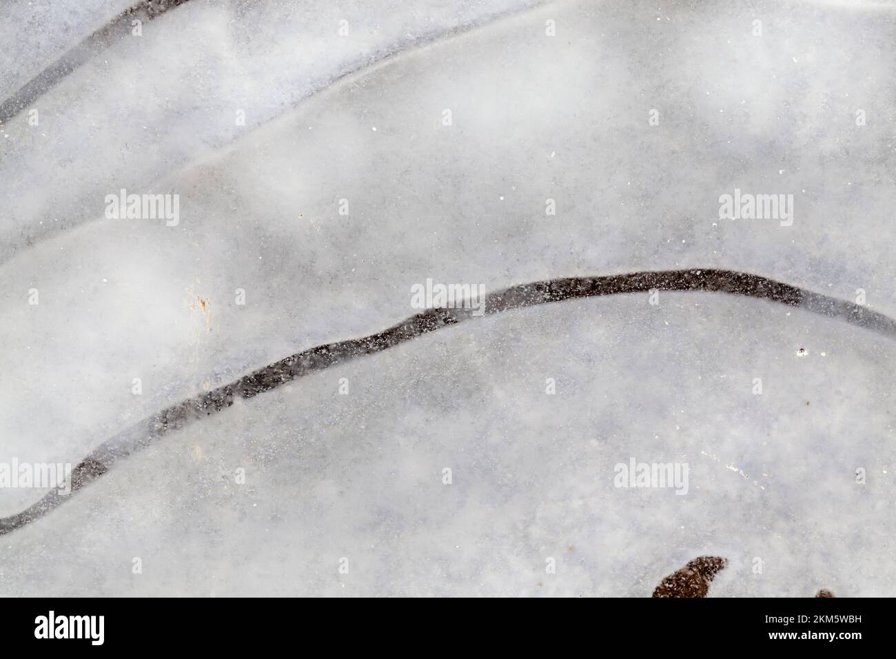 a thick layer of ice formed on the territory of the field after rains ...