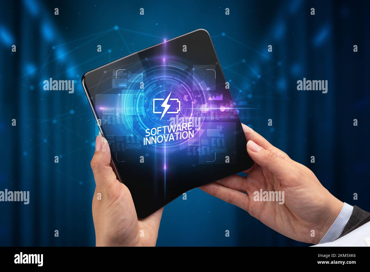 Businessman holding a foldable smartphone, technology concept Stock ...