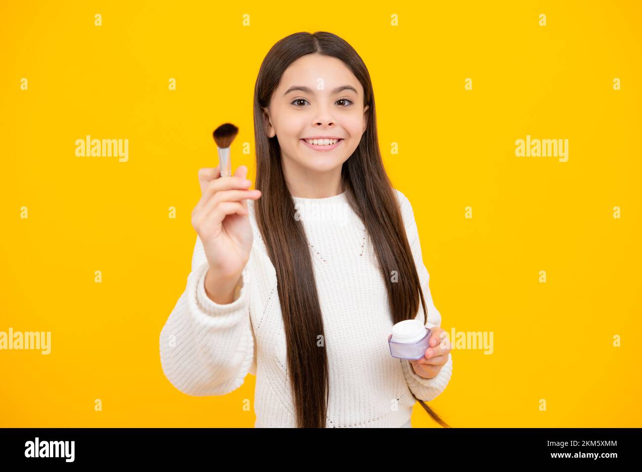 Child girl 12, 13, 14 years old making beauty make up with powder and ...