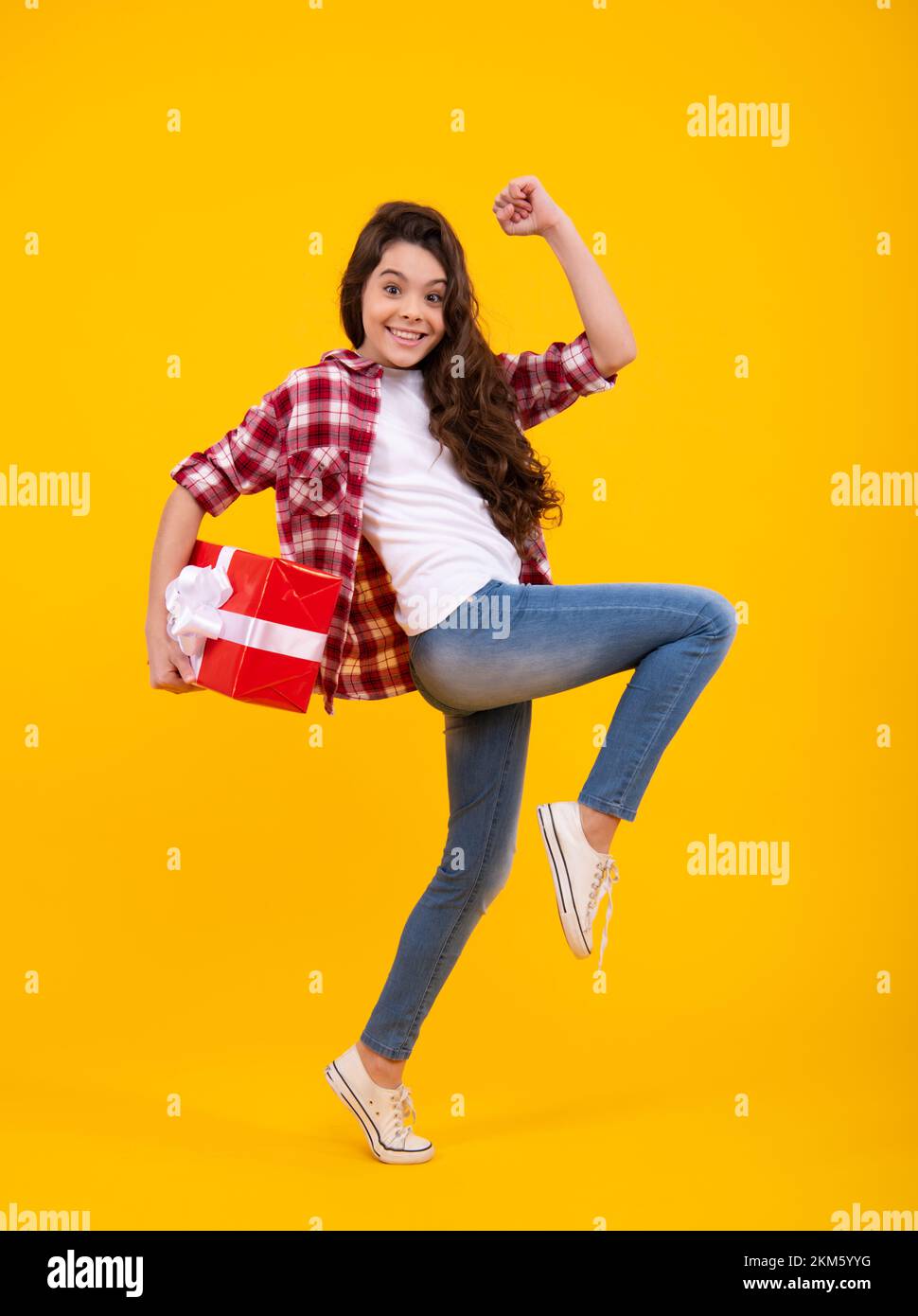 Child with gift present box on isolated background. Presents for ...