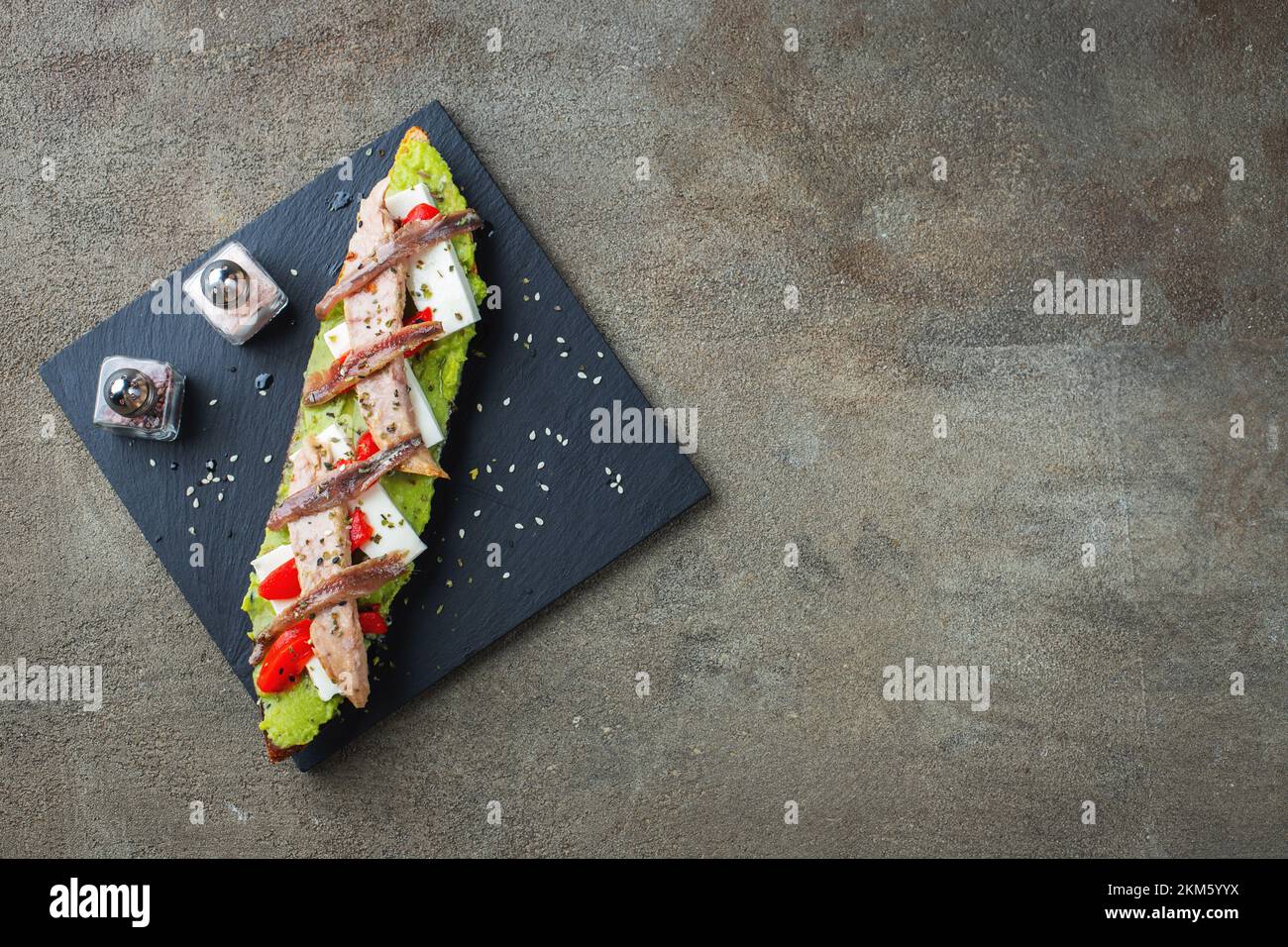 Traditional Spanish breakfast. Tostada with different toppings on a ...