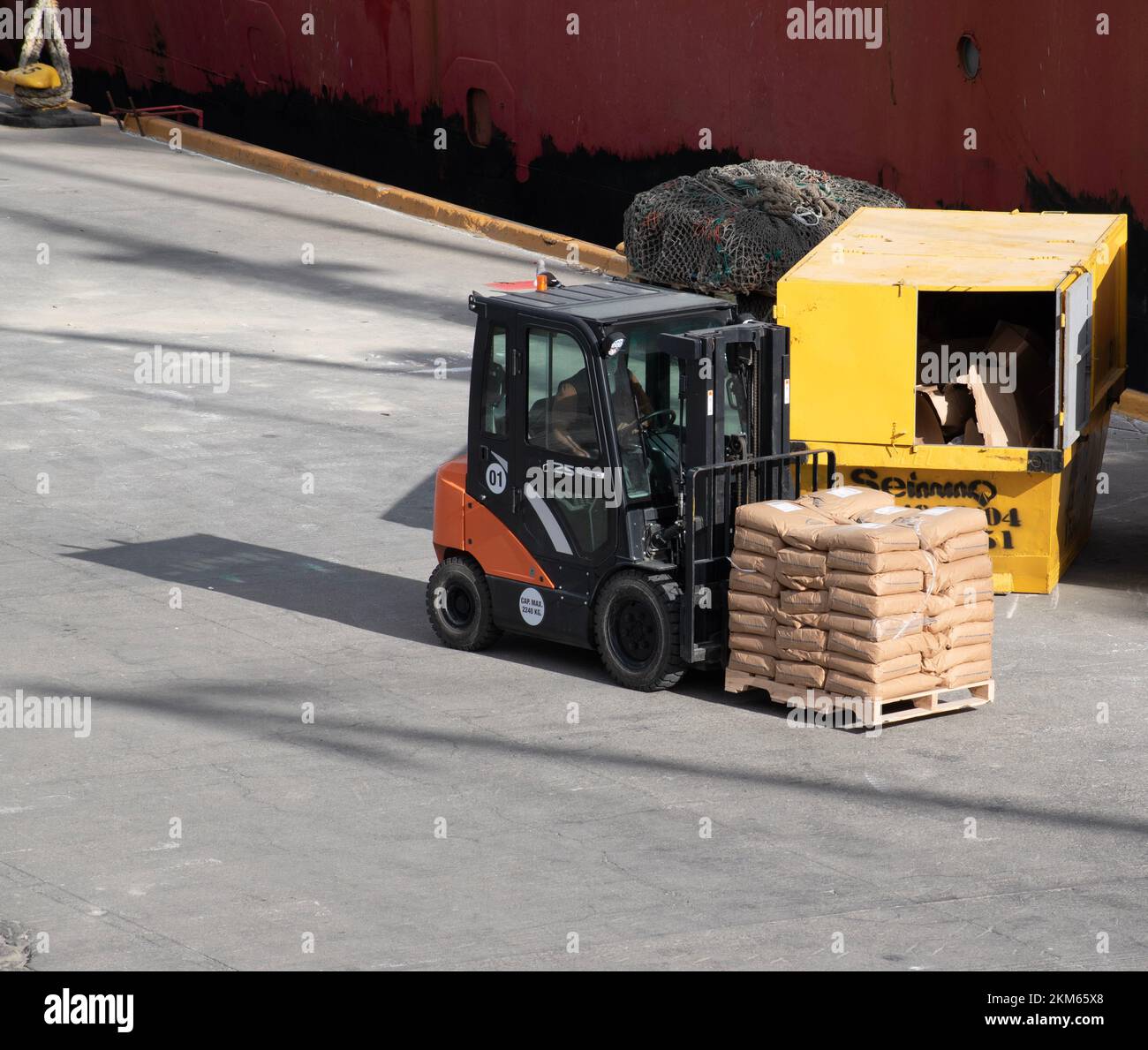 A forklift picking up items while on the dock in Ushuaia Argentina ...