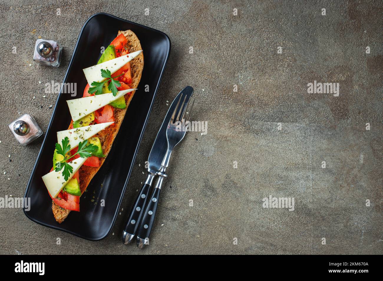 Traditional Spanish breakfast. Tostada with different toppings on a ...