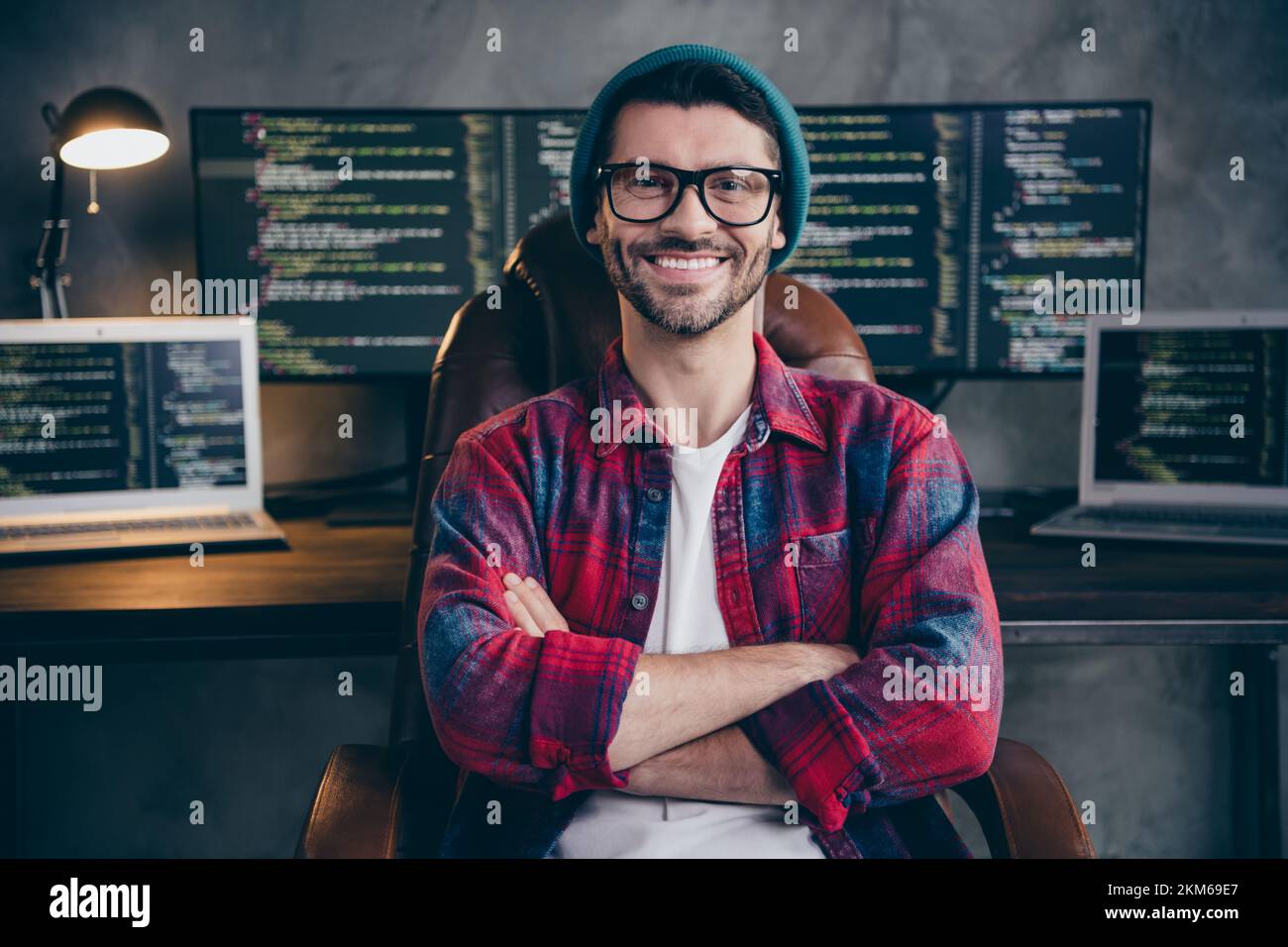 Photo of good mood happy coder dressed hat glasses smiling arms folded ...
