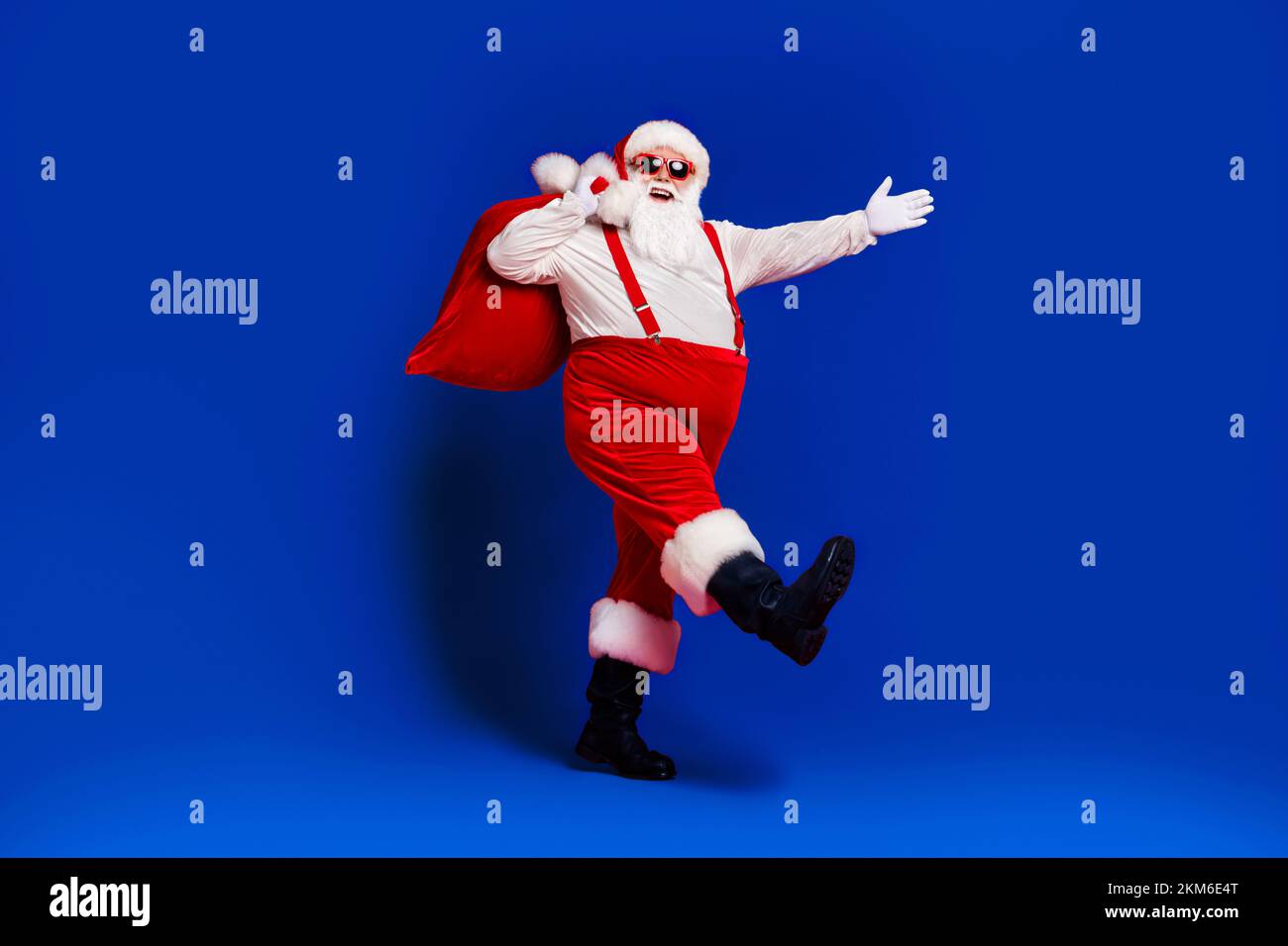 Full length body size view of his he attractive cheerful cheery Santa ...