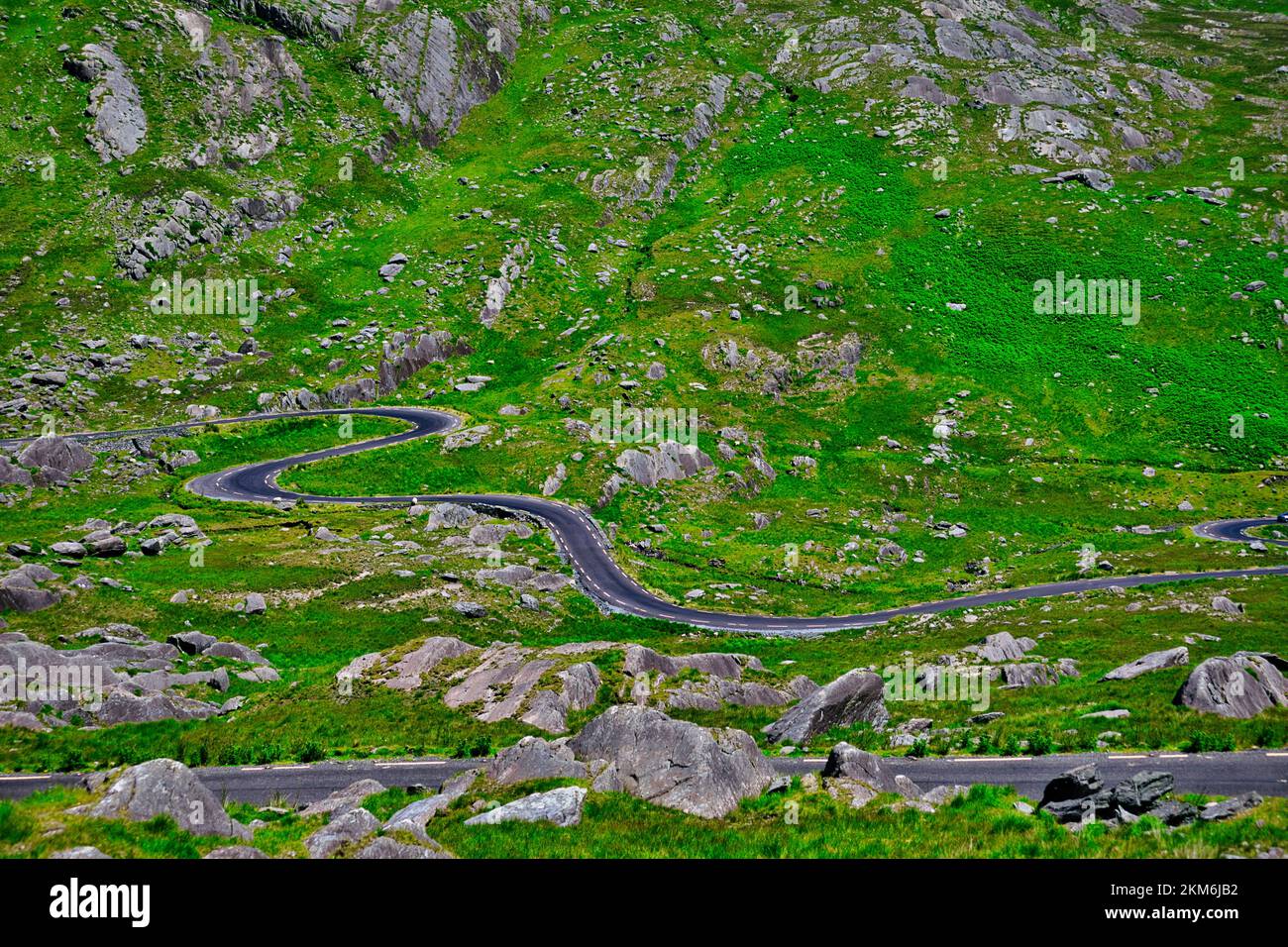 Road winding through the rugged Caha Mountains towards the peak at ...