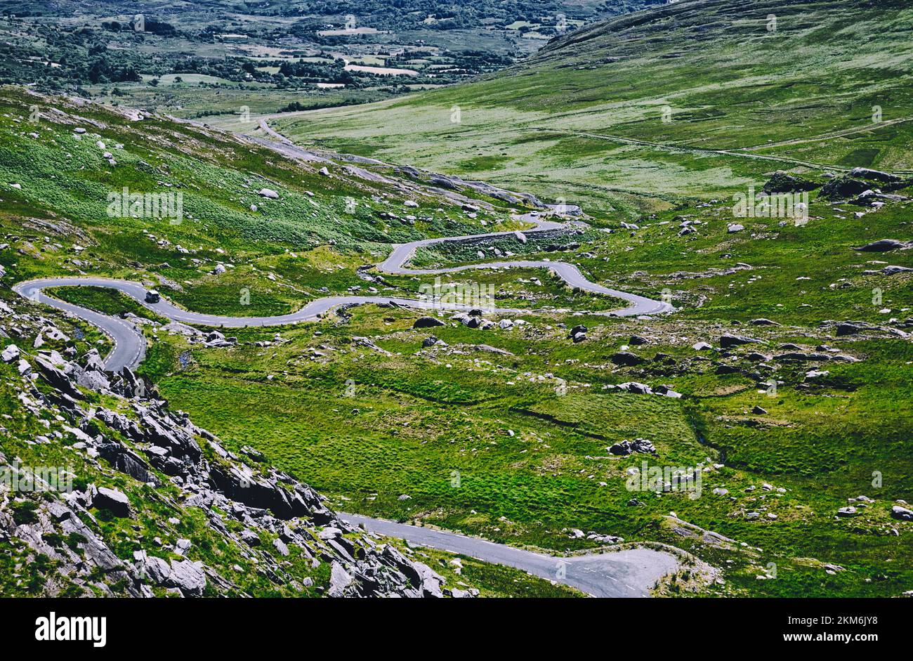 Road winding through the rugged Caha Mountains towards the peak at ...