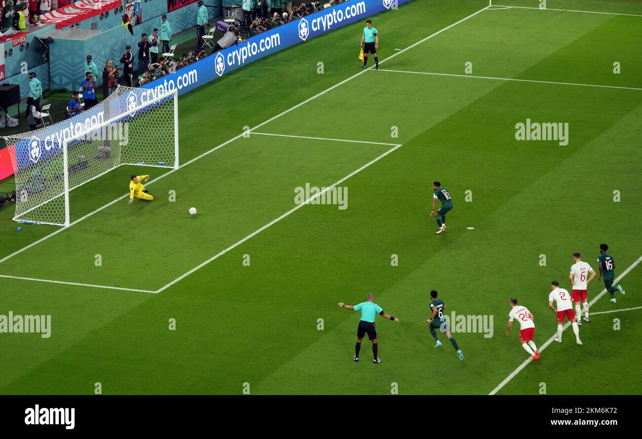Poland goalkeeper Wojciech Szczesny saves a penalty from Saudi Arabia's ...