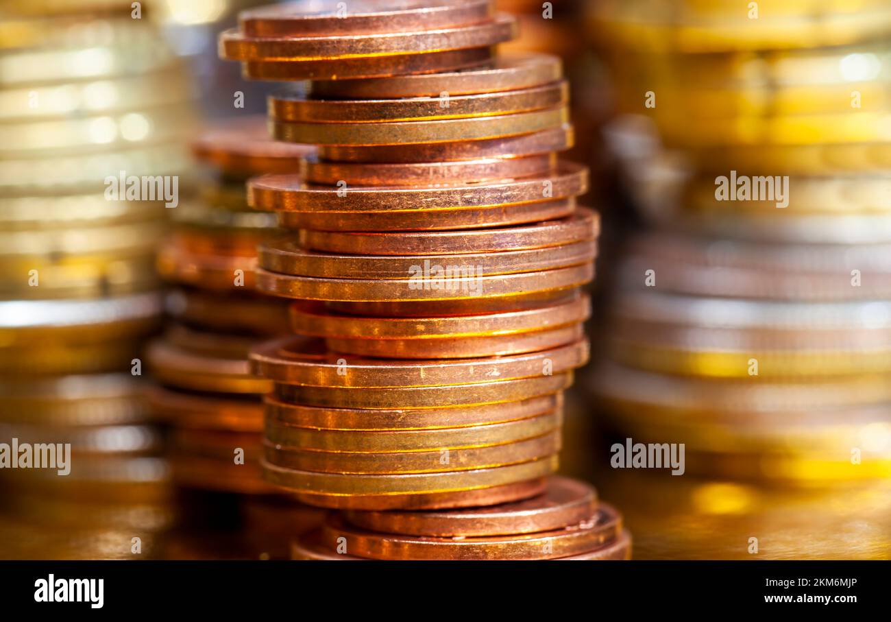 a large number of coins lying together, metal coins of different ...