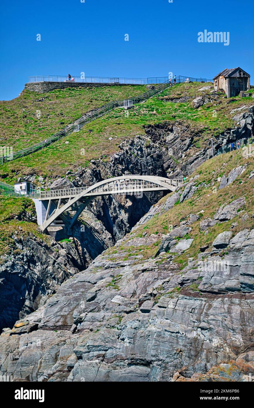 Reinforced concrete footbridge over dramatic sea gorge linking Cloghane ...