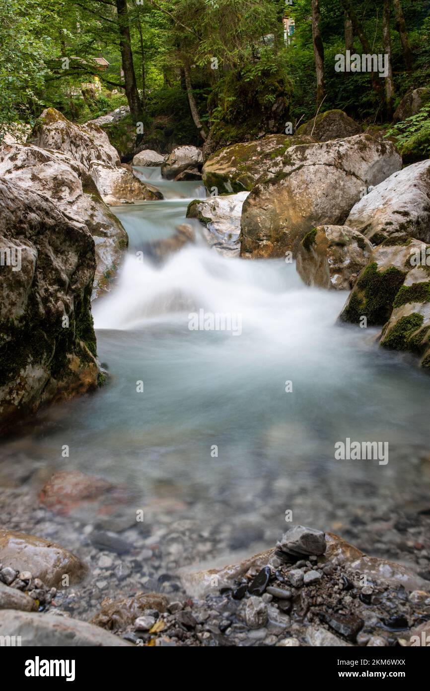A vertical long exposure shot of a rocky cascading waterfall Stock ...