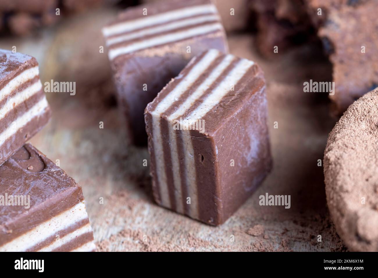 multi-layered sweets made of cream and chocolate layers with different ...