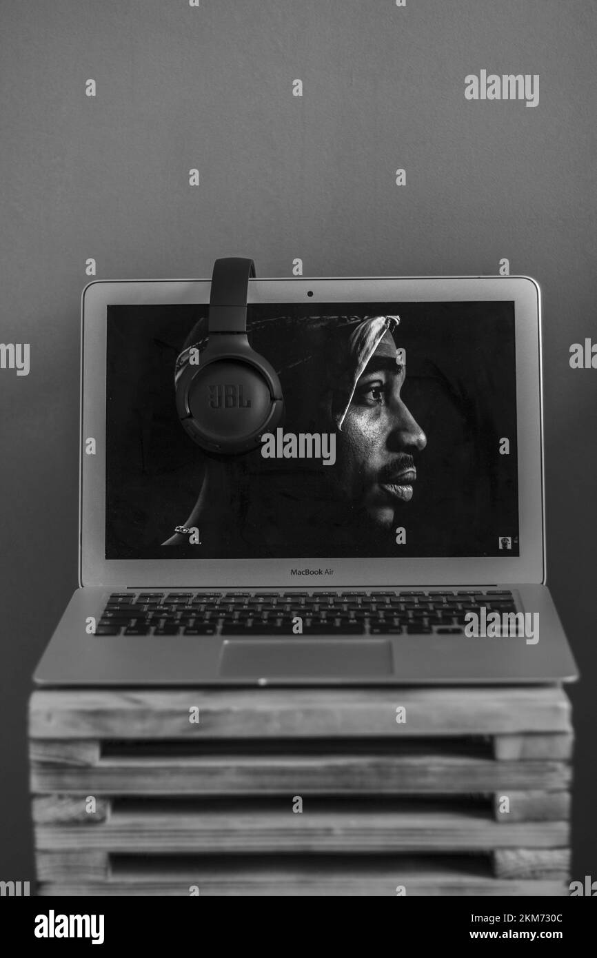 A vertical shot of Apple MacBook Air and JBL Headphone Stock Photo - Alamy