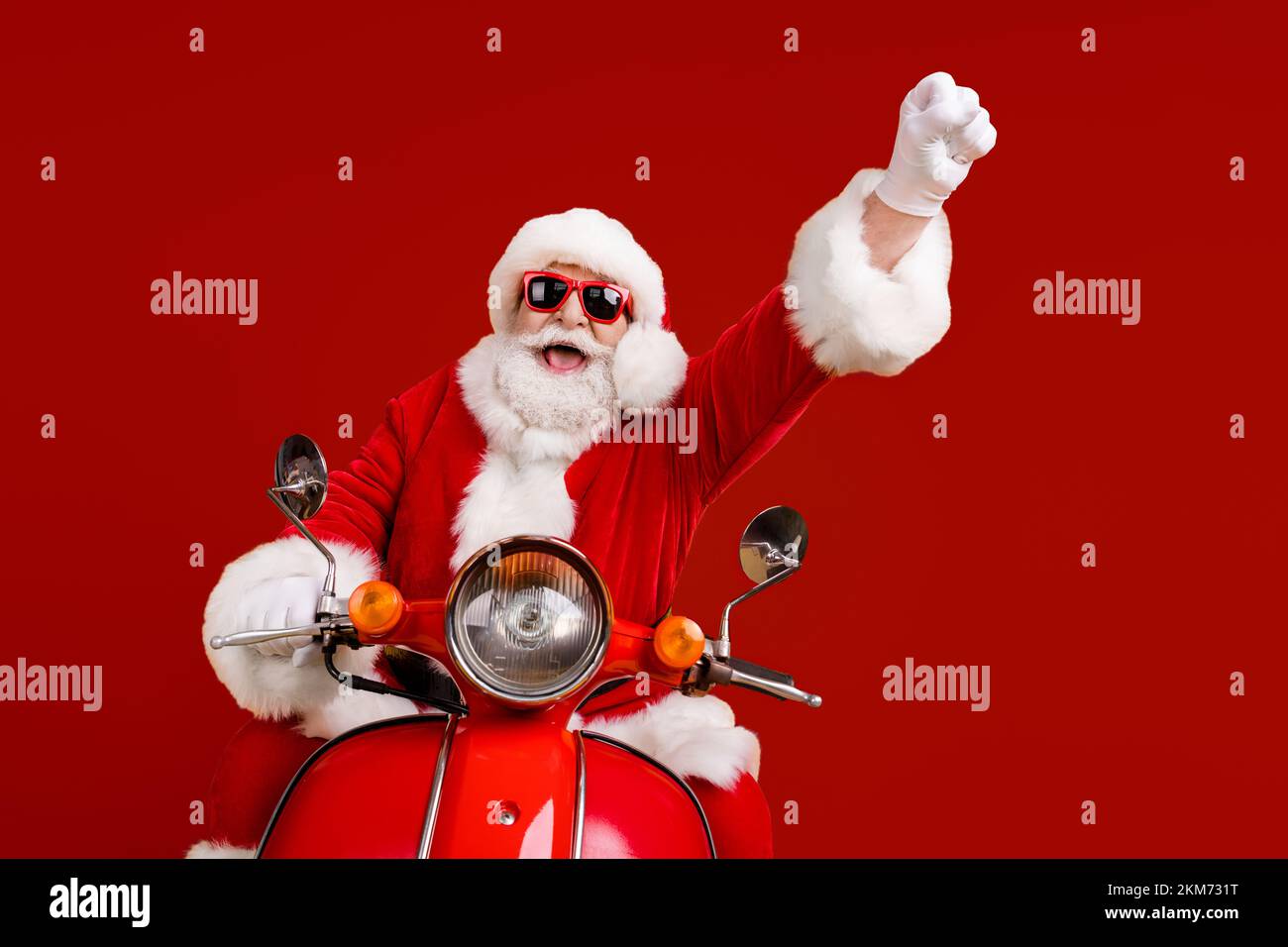 Portrait of his he nice funny cheerful cheery Santa riding moped fast ...