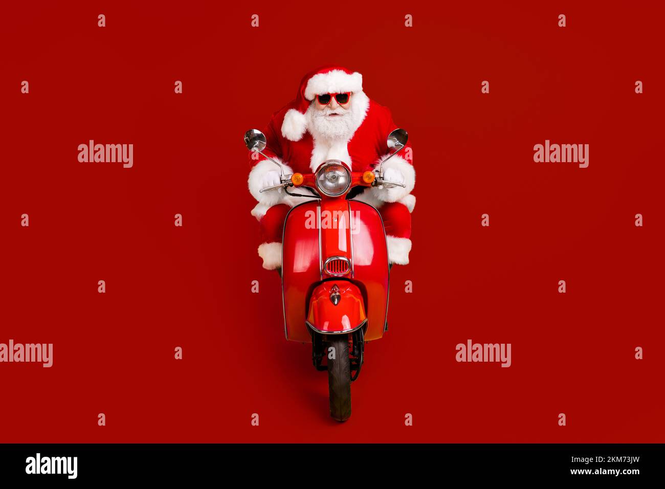 Portrait of his he nice funny fat focused serious Santa St Nicholas driving motor bike traveling ...
