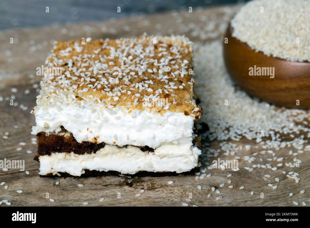 creamy cream and caramel cakes sprinkled with sesame seeds during ...