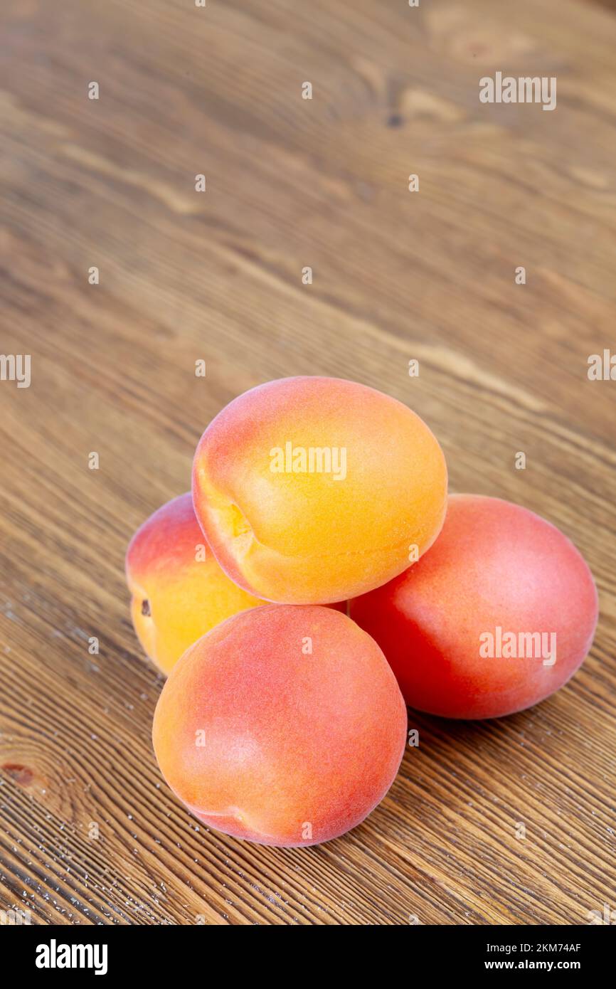 orange sweet apricots on the table in the kitchen, cooking from fruit ...