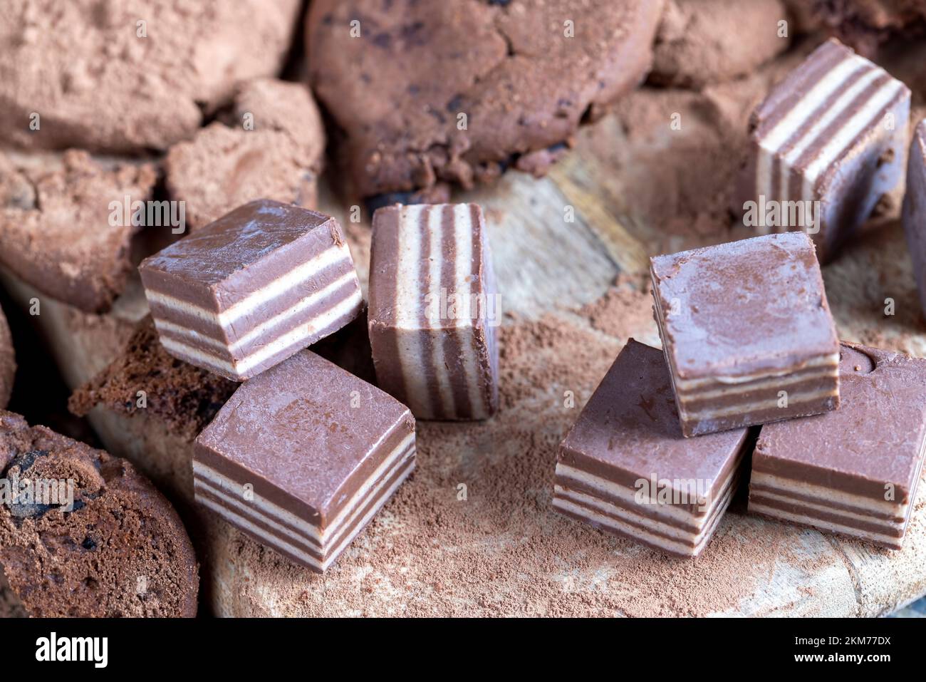 multi-layered sweets made of cream and chocolate layers with different ...