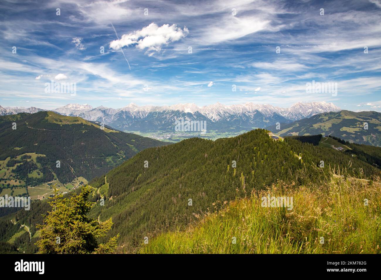A beautiful scenery of a forested hillside on the background of rocky ...