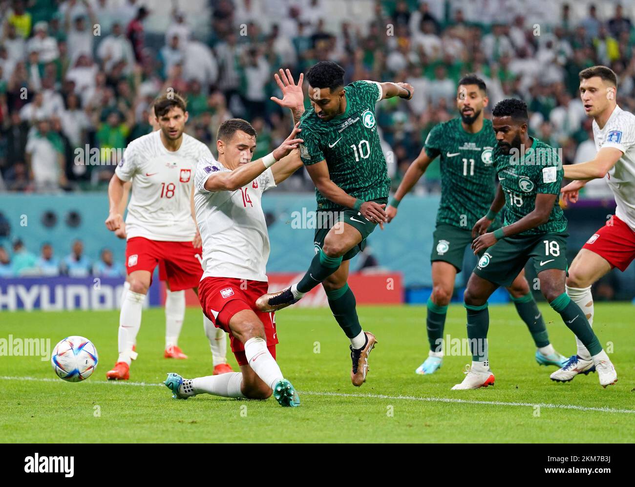 Saudi Arabia's Salem Al-Dawsari (centre) attempts a shot on goal during ...