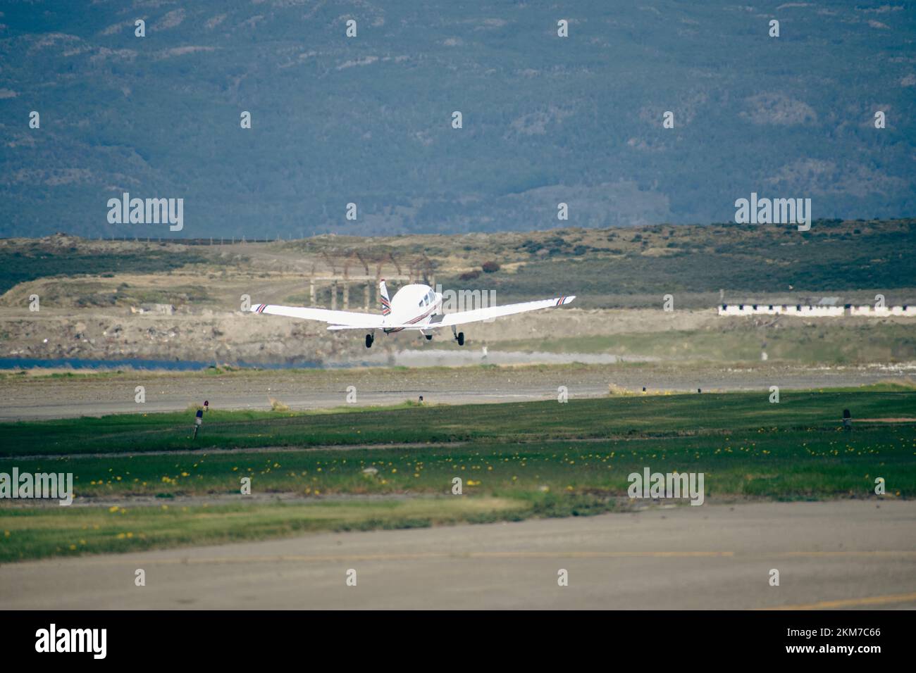 A small single-engine plane taking off from Ushuaia, Argentina. With ...