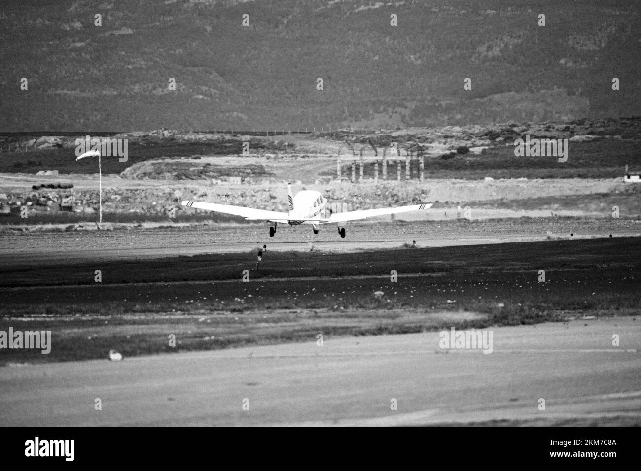 A small single-engine plane taking off from Ushuaia, Argentina. With ...