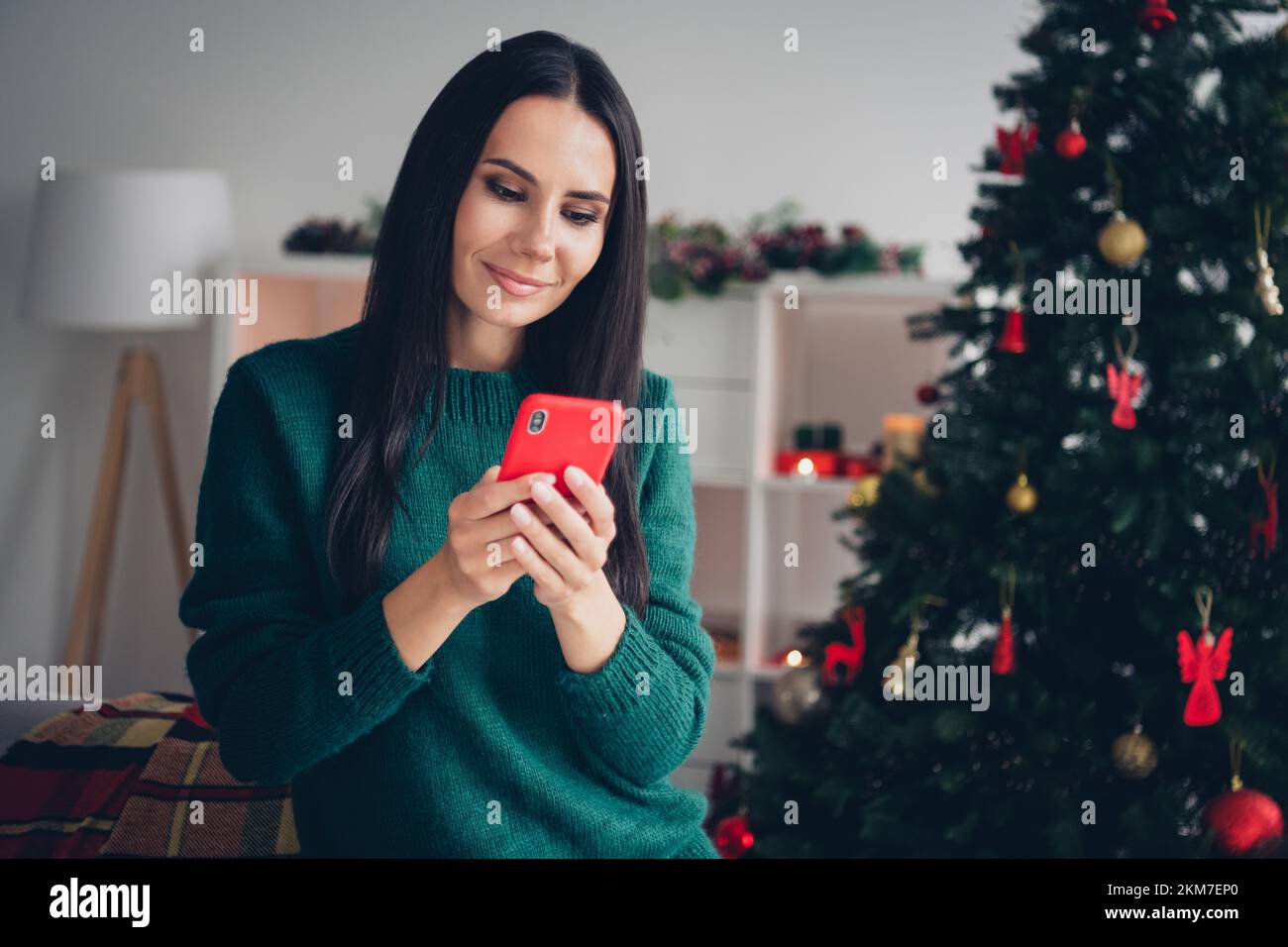 Photo of charming pretty lady dressed knitted x-mas sweater chatting ...